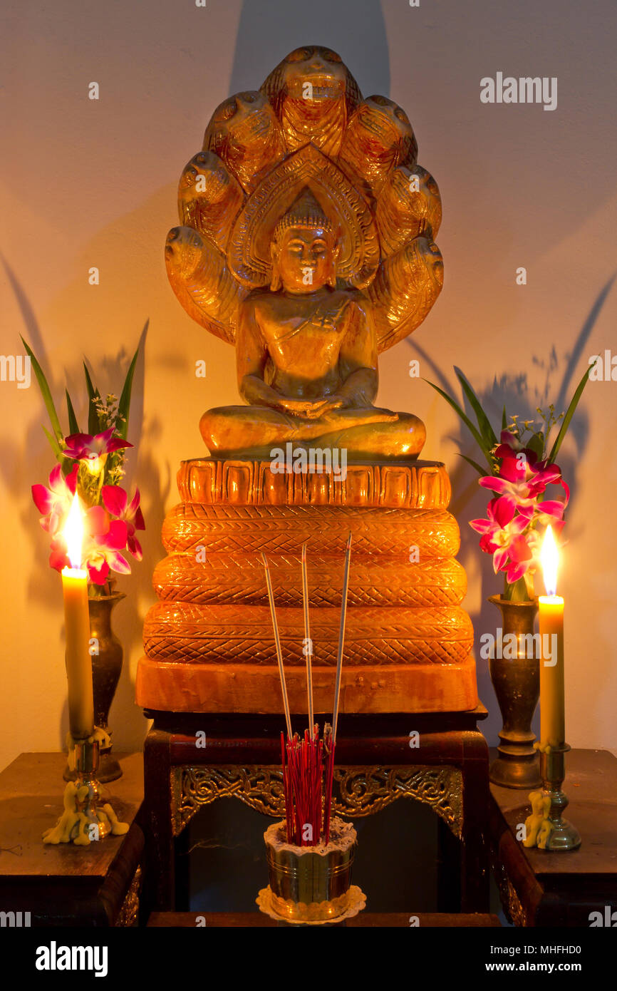 Buddha image behind burning joss stick and candle Stock Photo - Alamy
