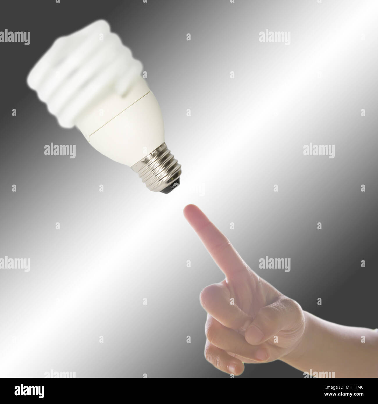 Hand child with point to Light bulb Stock Photo - Alamy