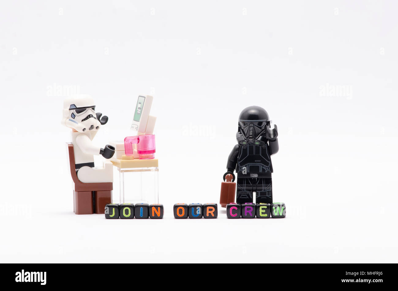 mini figure of storm trooper on chair and death trooper with word join ...