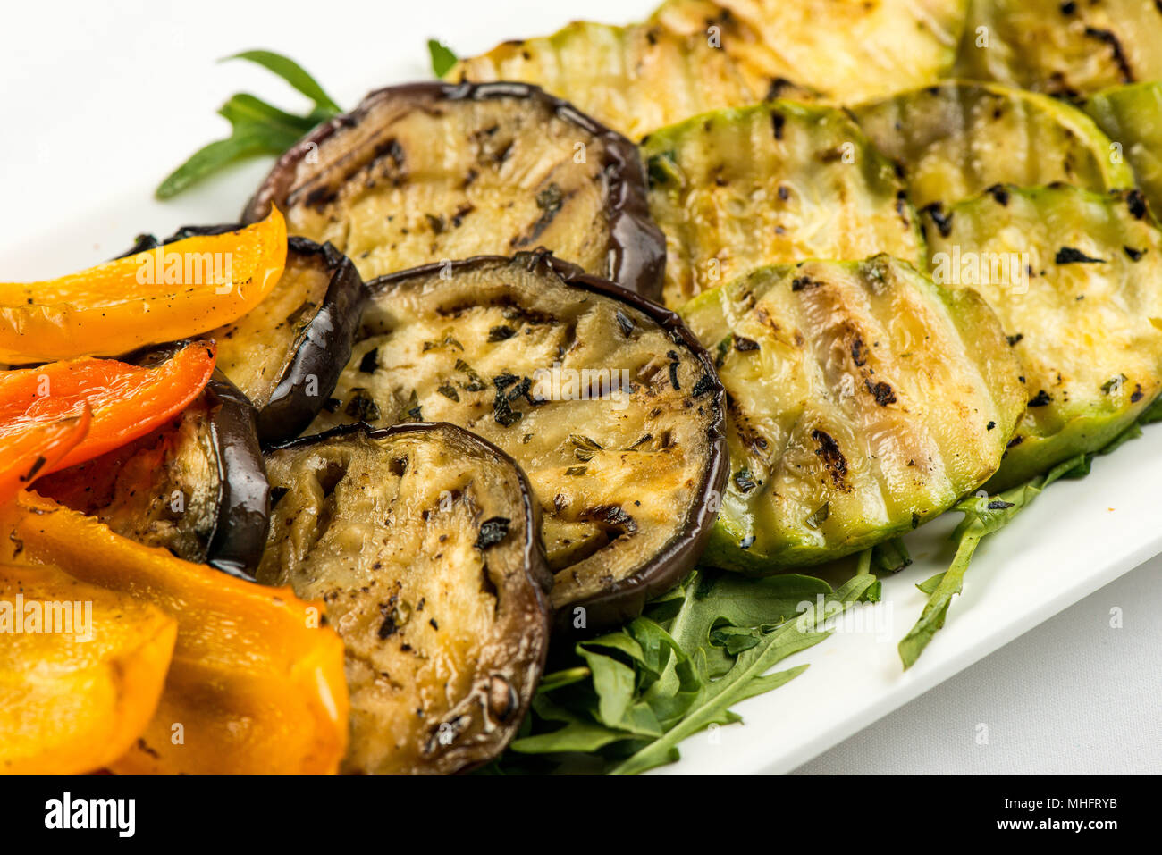 grilled vegetables on the grill macro. horizontal top view on white ...
