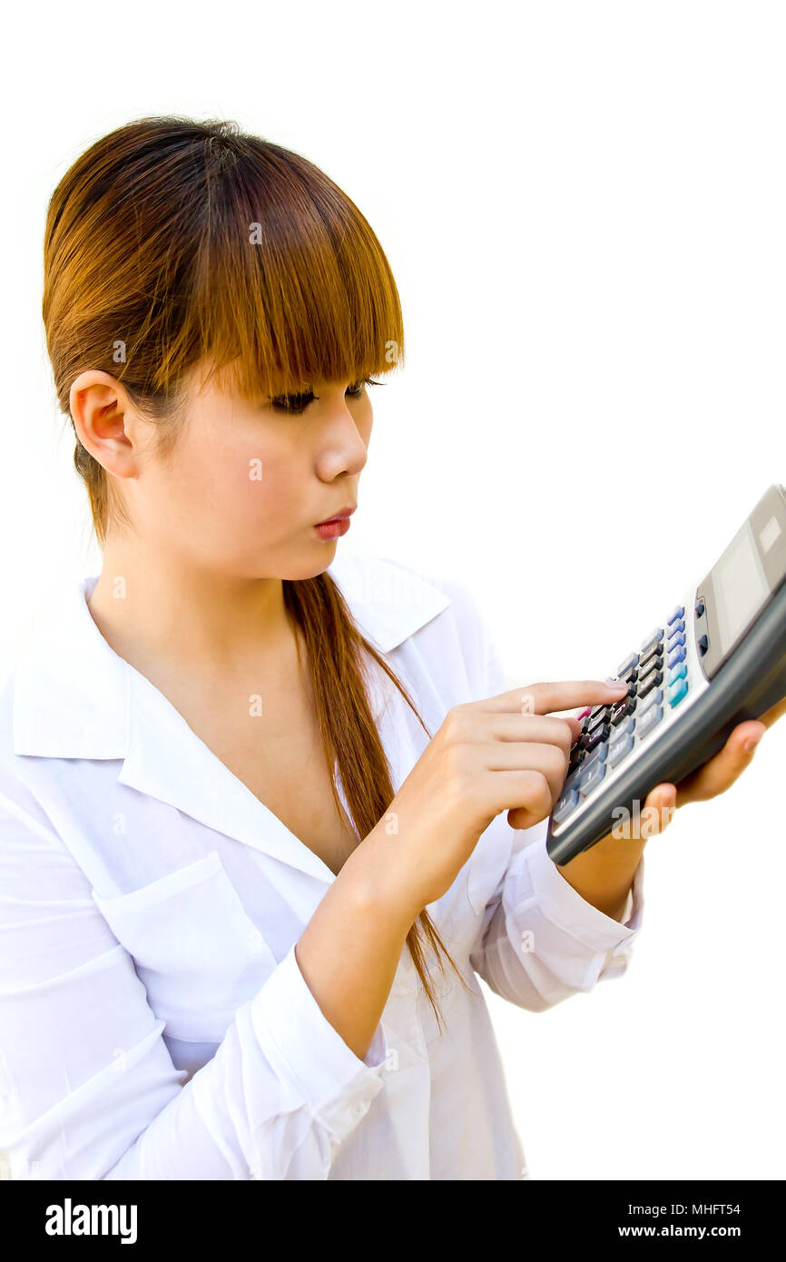 Thinking woman using calculator to make calculations Stock Photo - Alamy