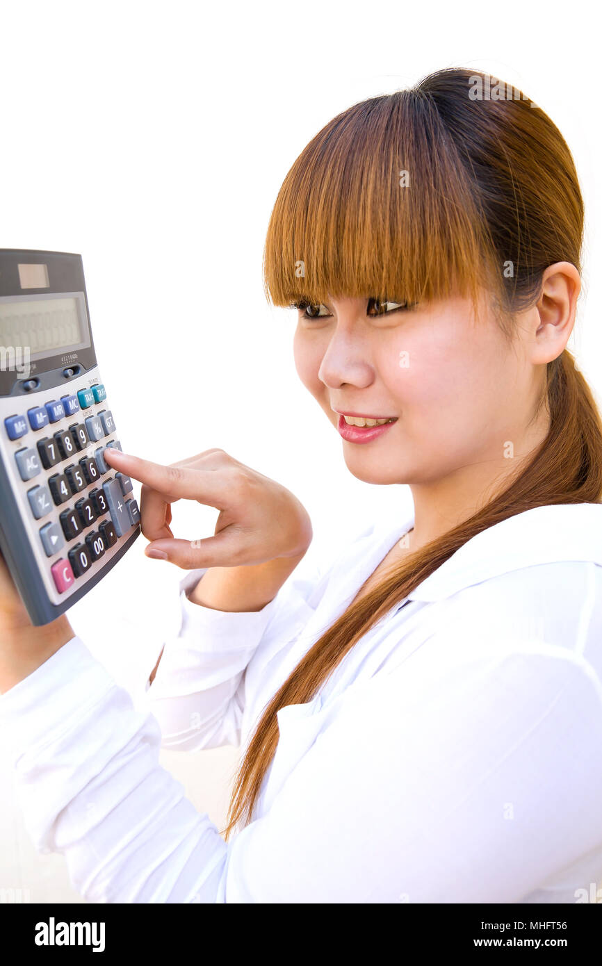 Thinking business woman using calculator to make calculations Stock ...