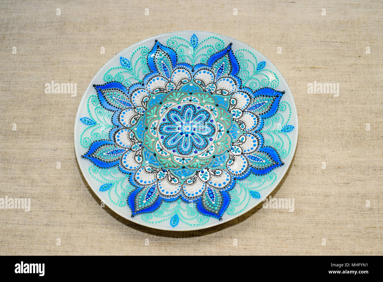 Decorative ceramic dish painted with hands. Art, handmade Stock Photo ...