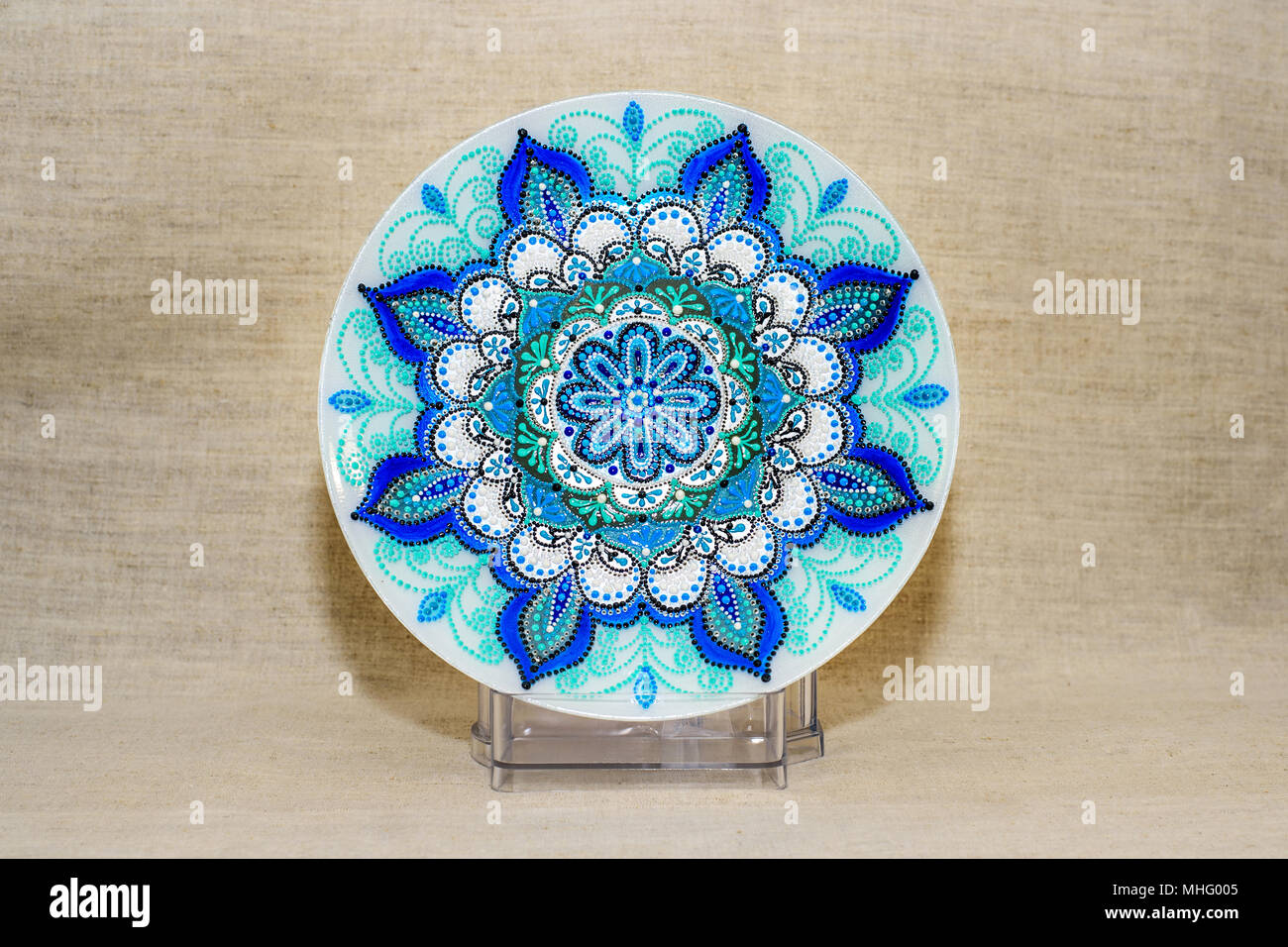 Decorative ceramic dish painted with hands. Art, handmade Stock Photo ...