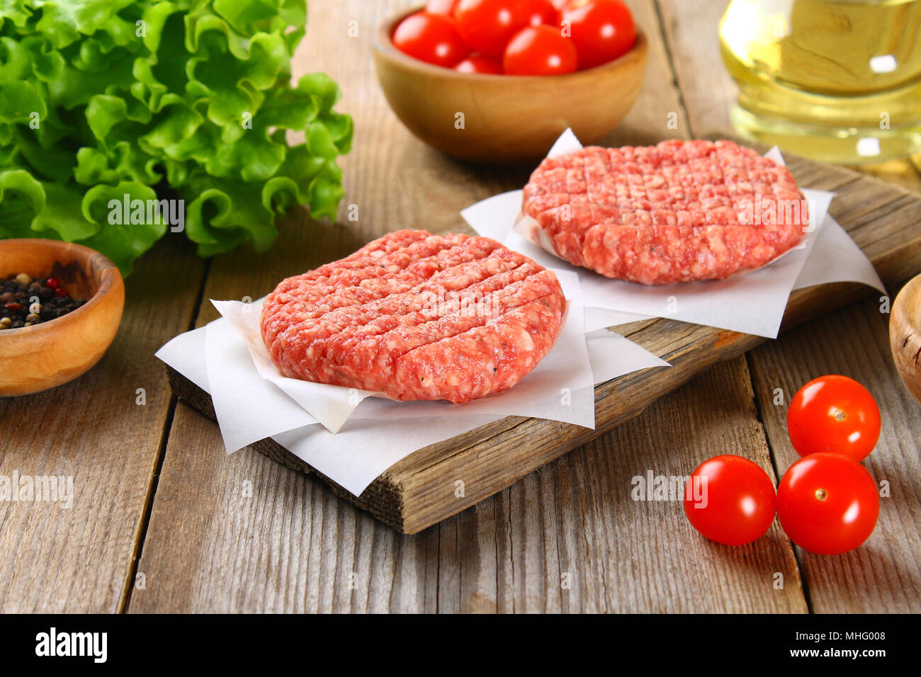 Raw minced meat for home made grill burgers cooking with spaces and ...