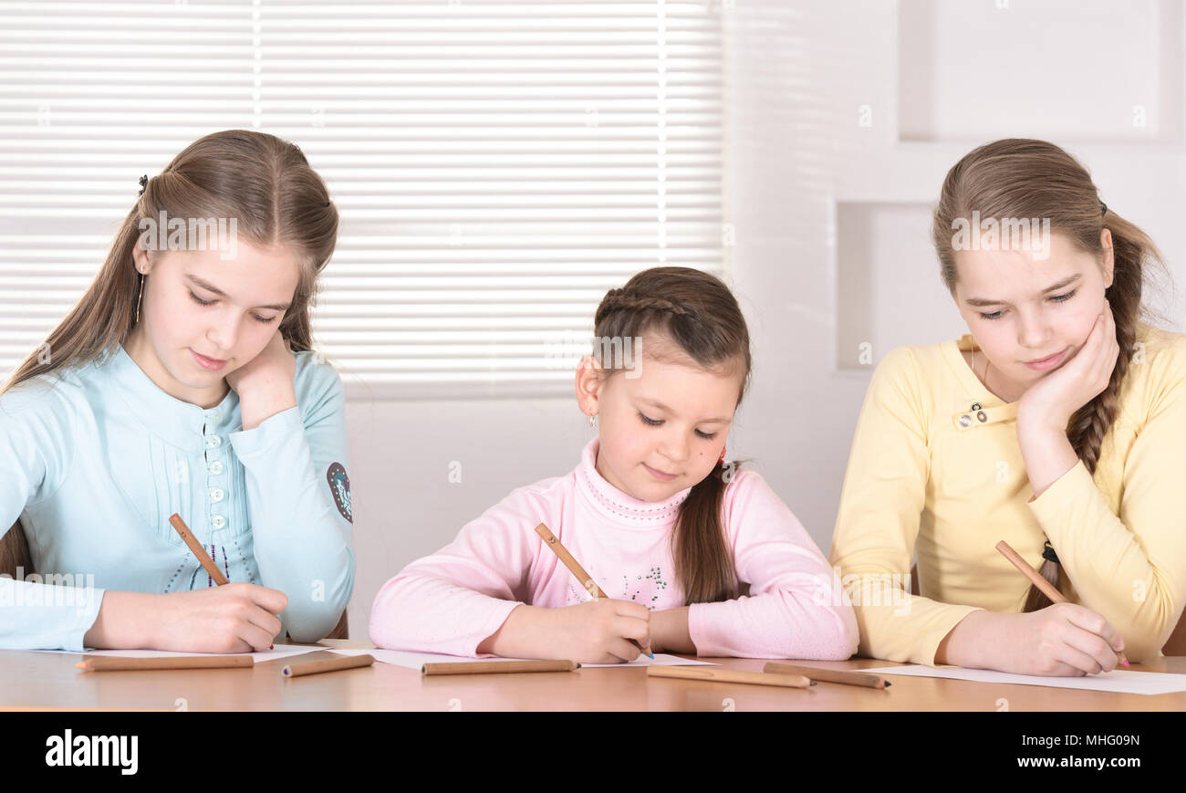 Beautiful girls doing homework Stock Photo - Alamy