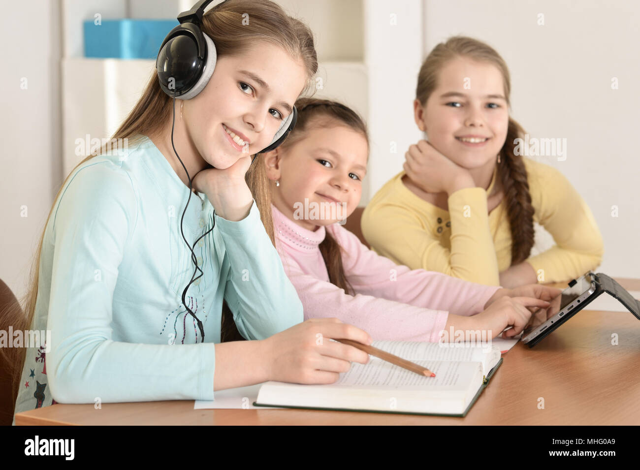 Beautiful girls doing homework Stock Photo - Alamy