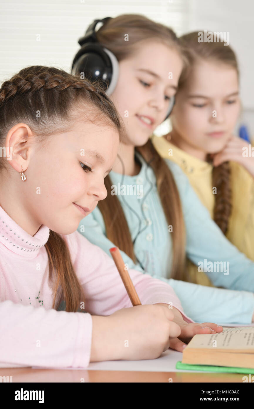 Beautiful girls doing homework Stock Photo - Alamy