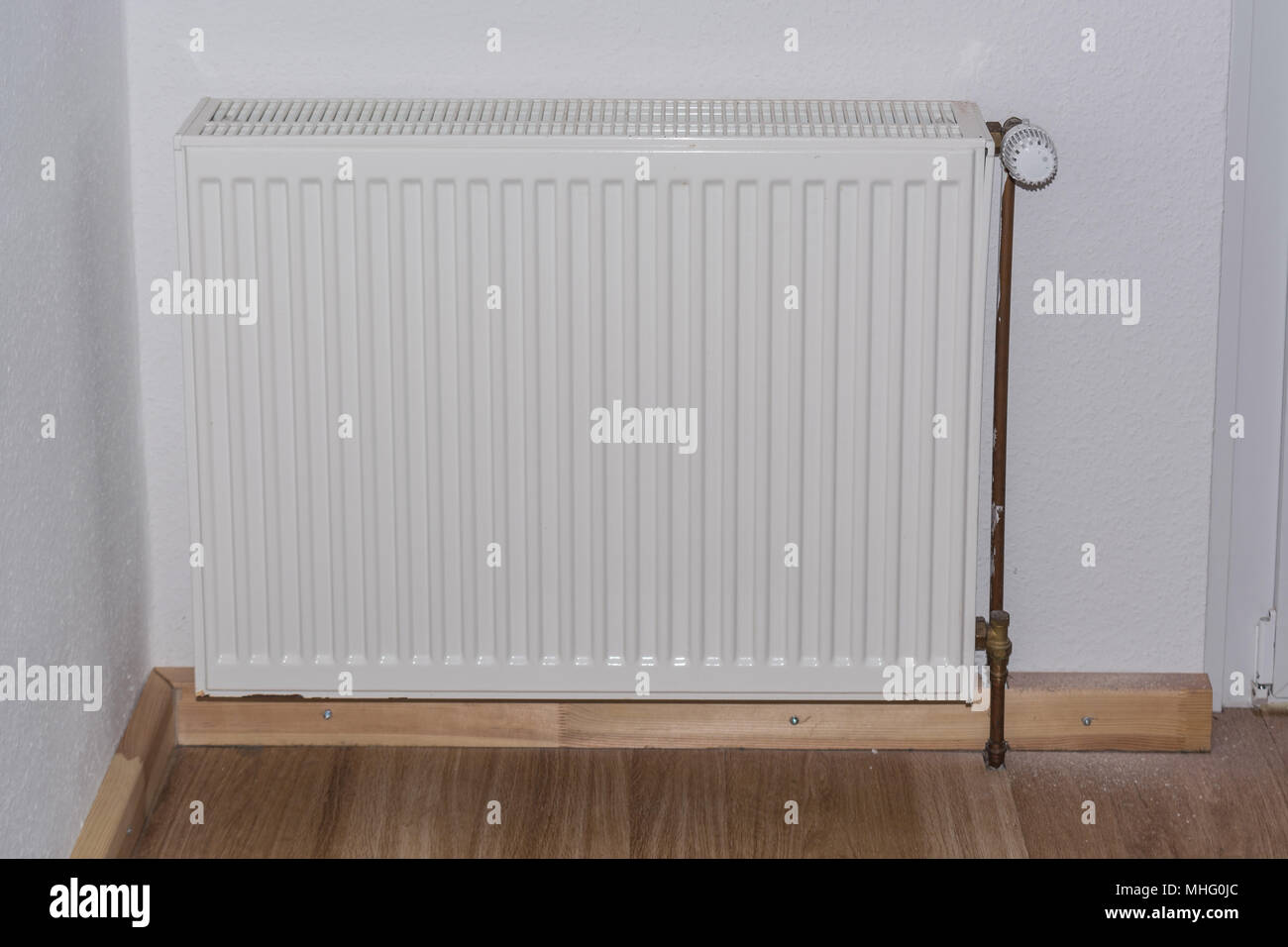 Old panel radiators in a renovated room Stock Photo - Alamy