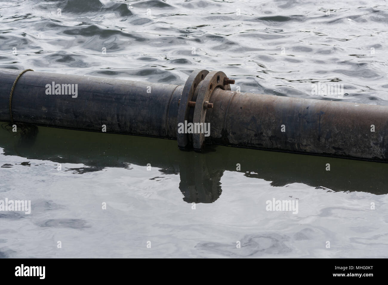 Pipeline, plastic pipes float on the water surface Stock Photo - Alamy
