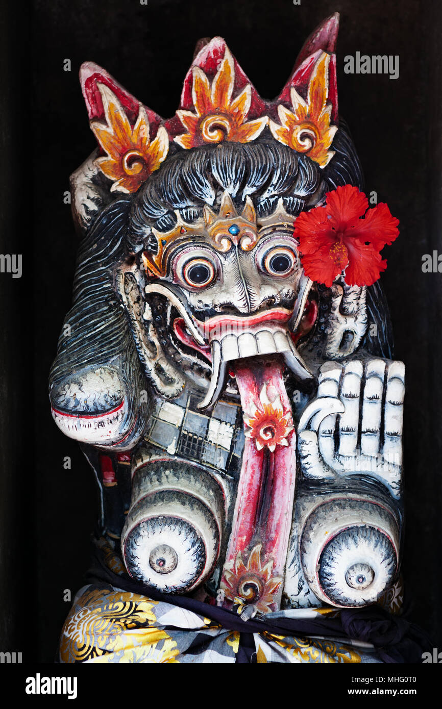 Old figure of traditional Balinese hindu spirit Rangda on wall of ...