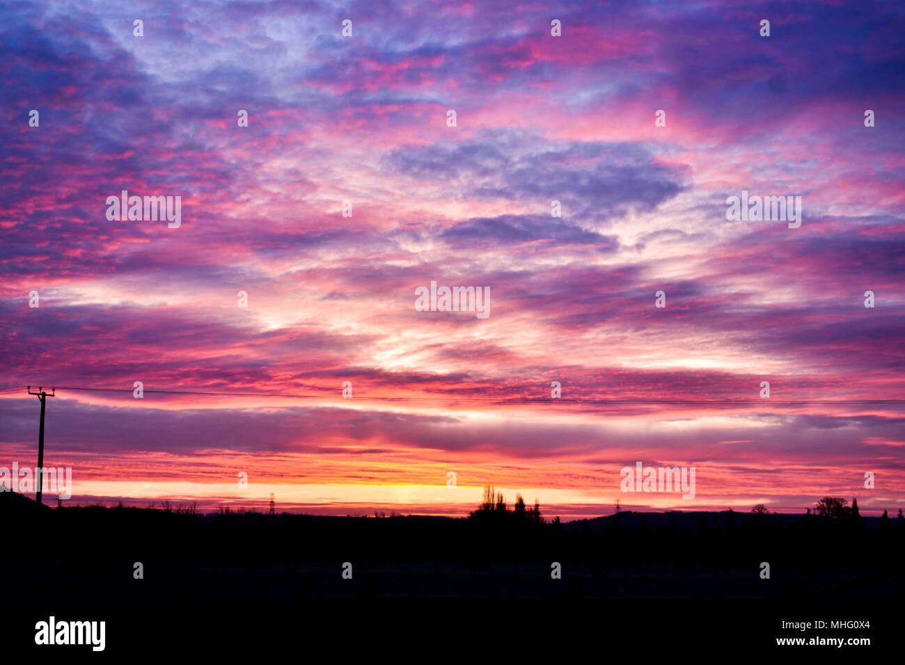 Winter sunrise across the cotswold with spectacular cloud reflection ...