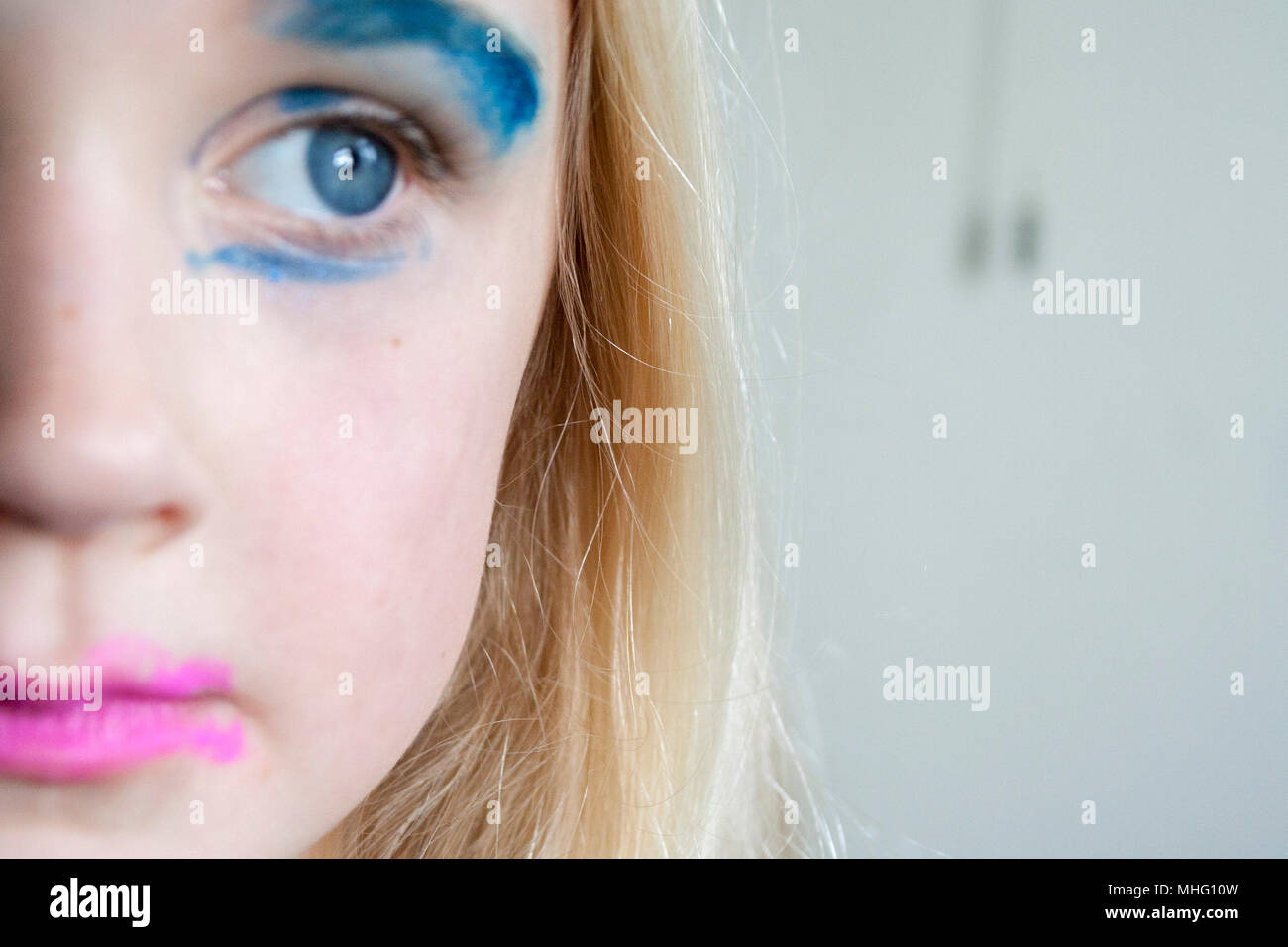 Blonde child girl kid, playing with makeup, eyeshadow, lipstick, pink ...