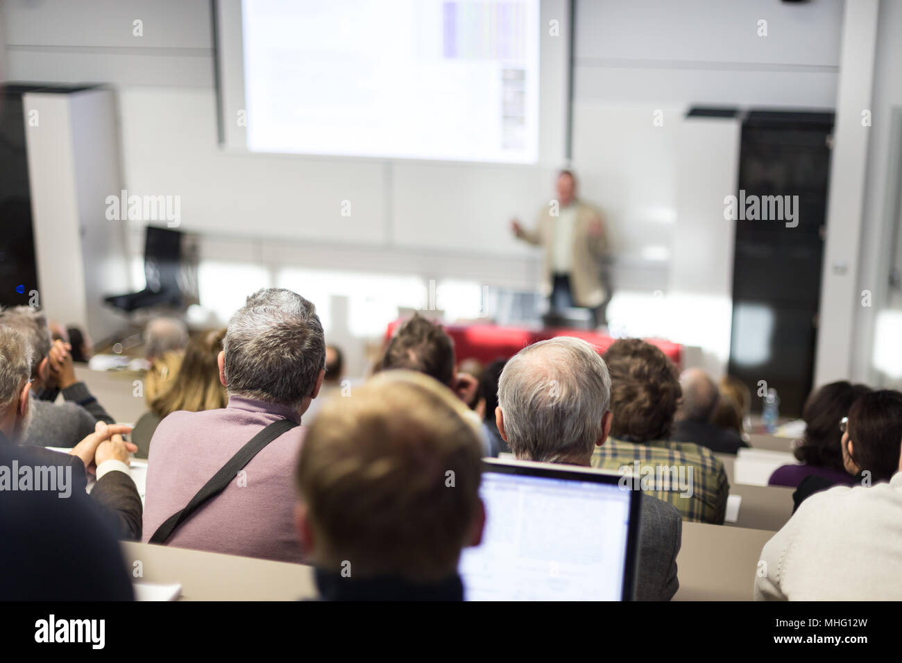 Business speaker giving a talk at business conference event Stock Photo ...
