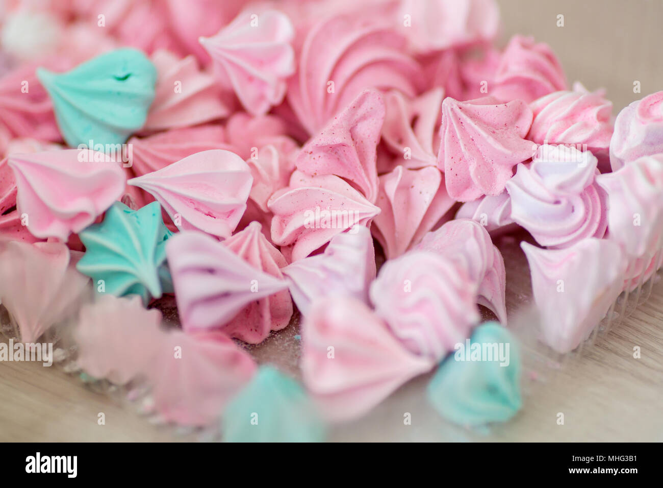 Many sweet biscuit meringue of different colors in box, closeup Stock ...