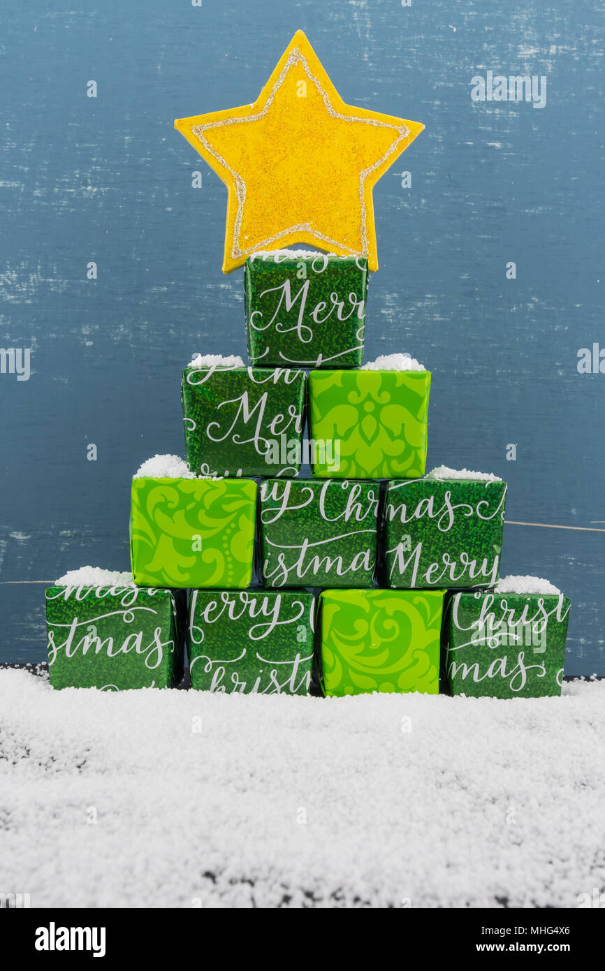 Small Stack of Gifts And Snow with Blue Background Stock Photo - Alamy