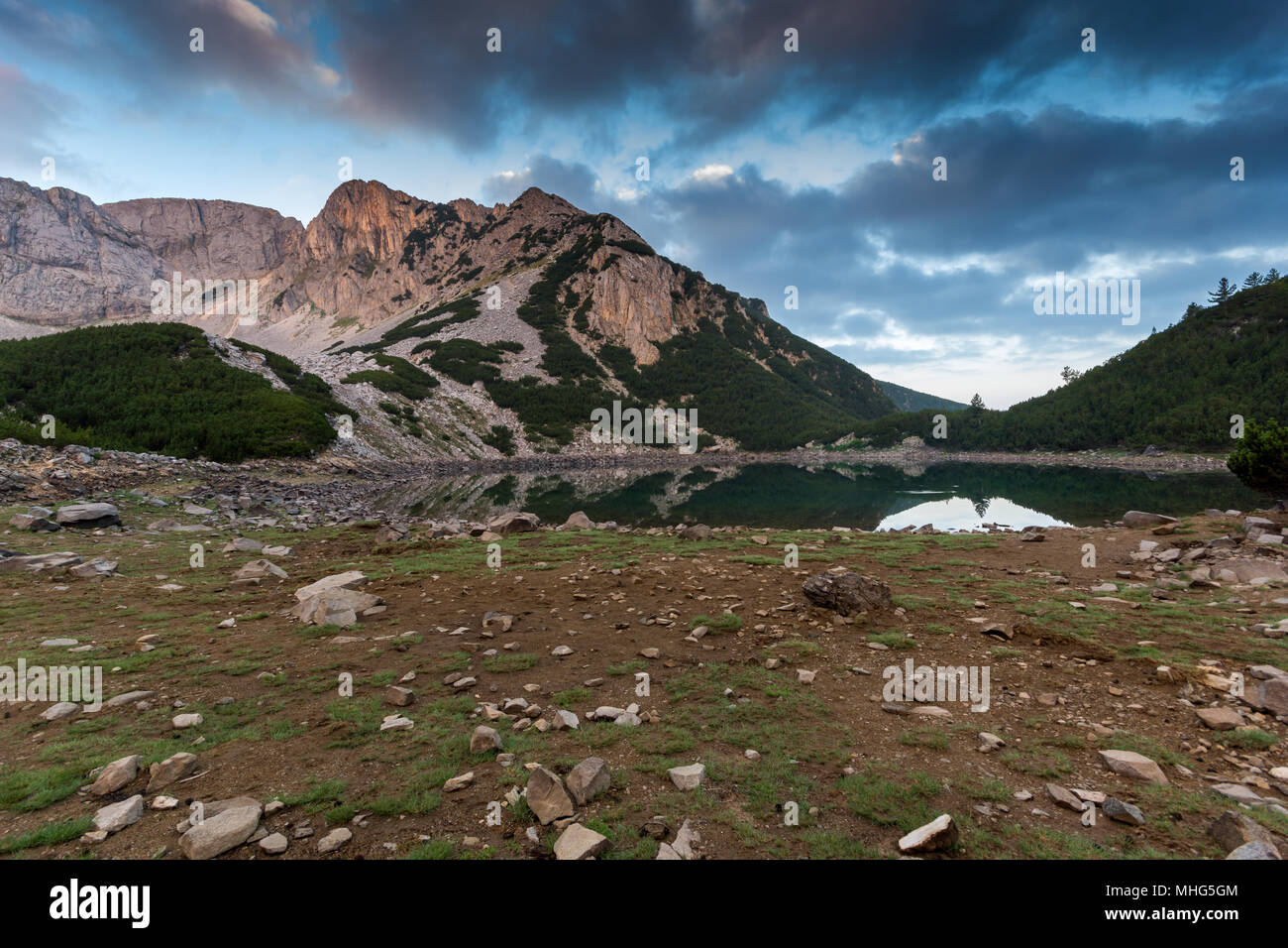 Amazing Sunrise with Colored in red rock of Sinanitsa peak and the lake ...