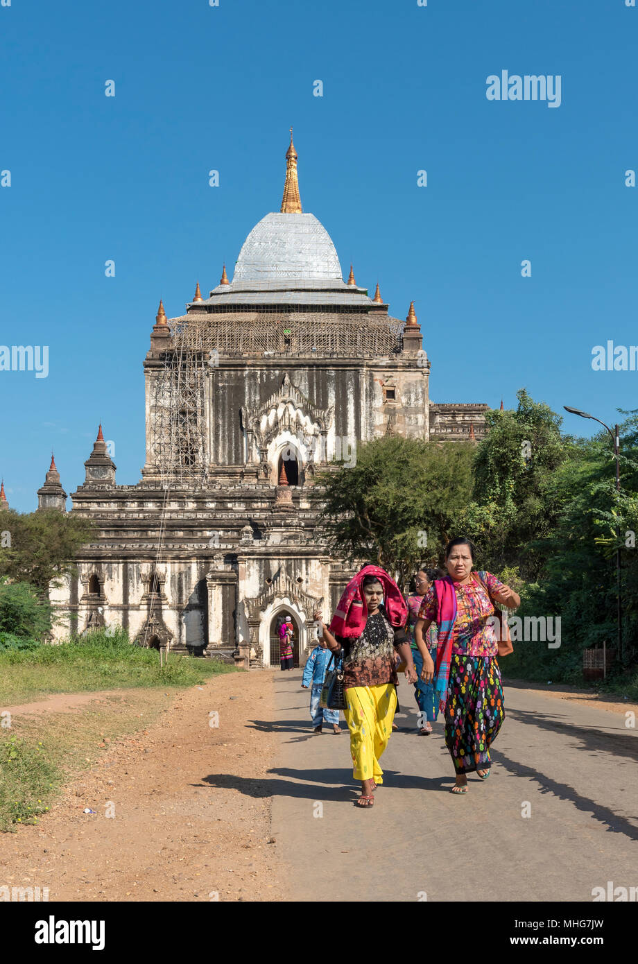 Burmese women in traditional dress outside Thatbyinnyu Temple, Bagan ...