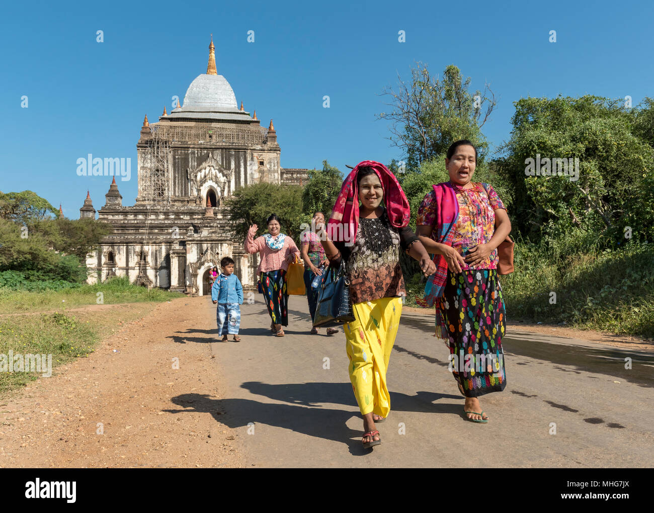 Burmese women in traditional dress outside Thatbyinnyu Temple, Bagan ...
