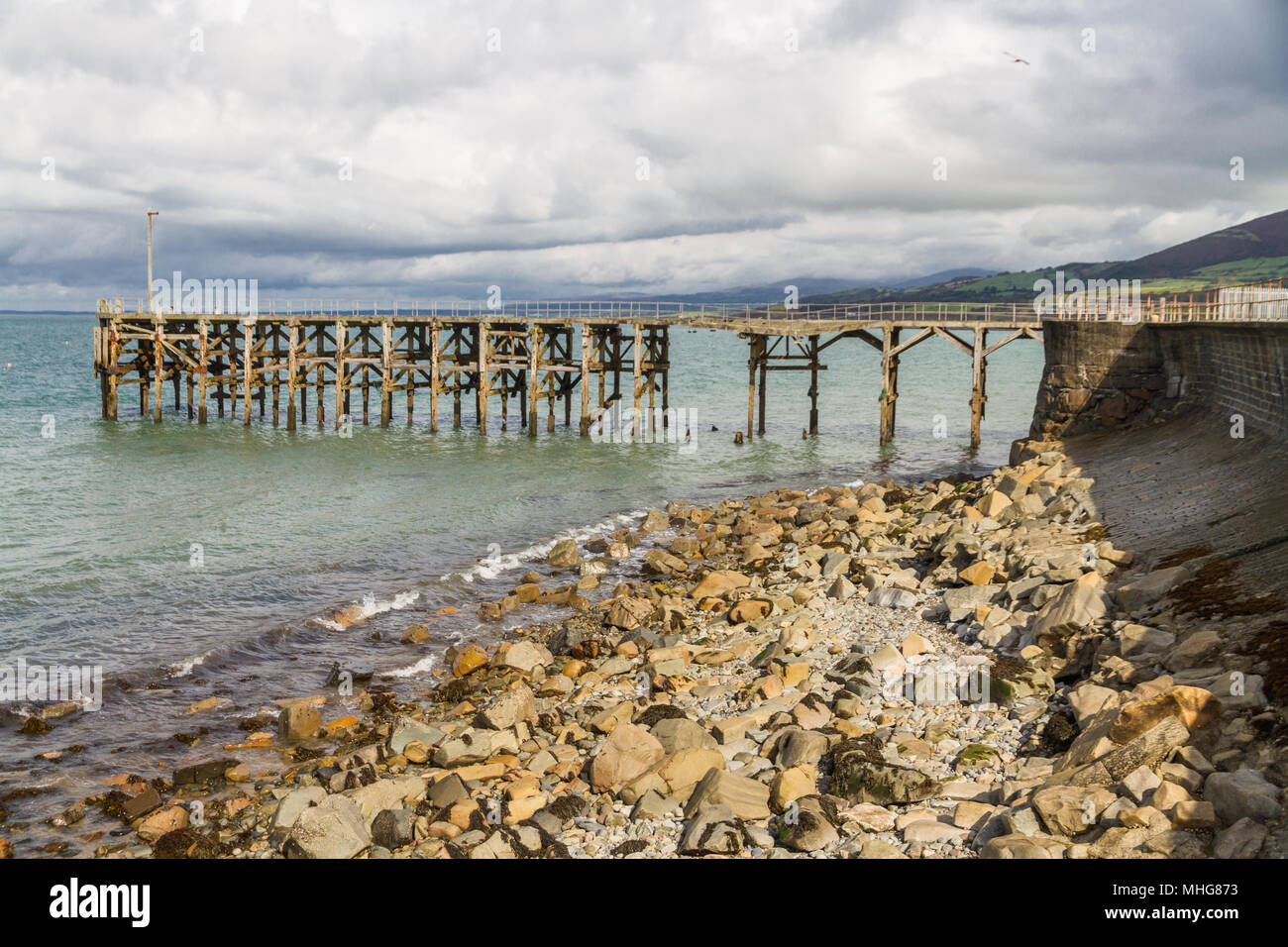 The derelict wooden pier at Trefor, llyn Peninsula, North Wales, UK ...