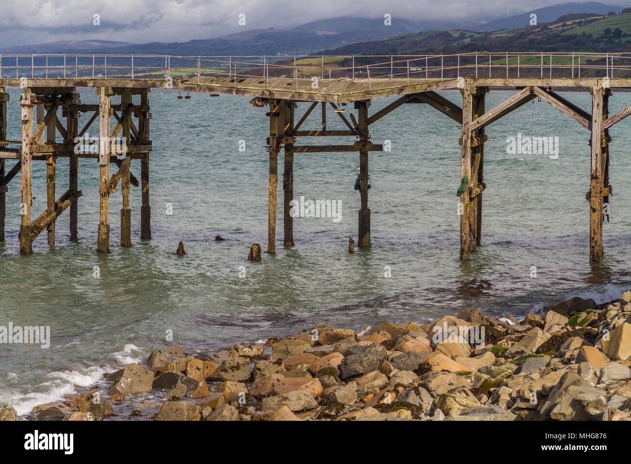 The derelict wooden pier at Trefor, llyn Peninsula, North Wales, UK ...