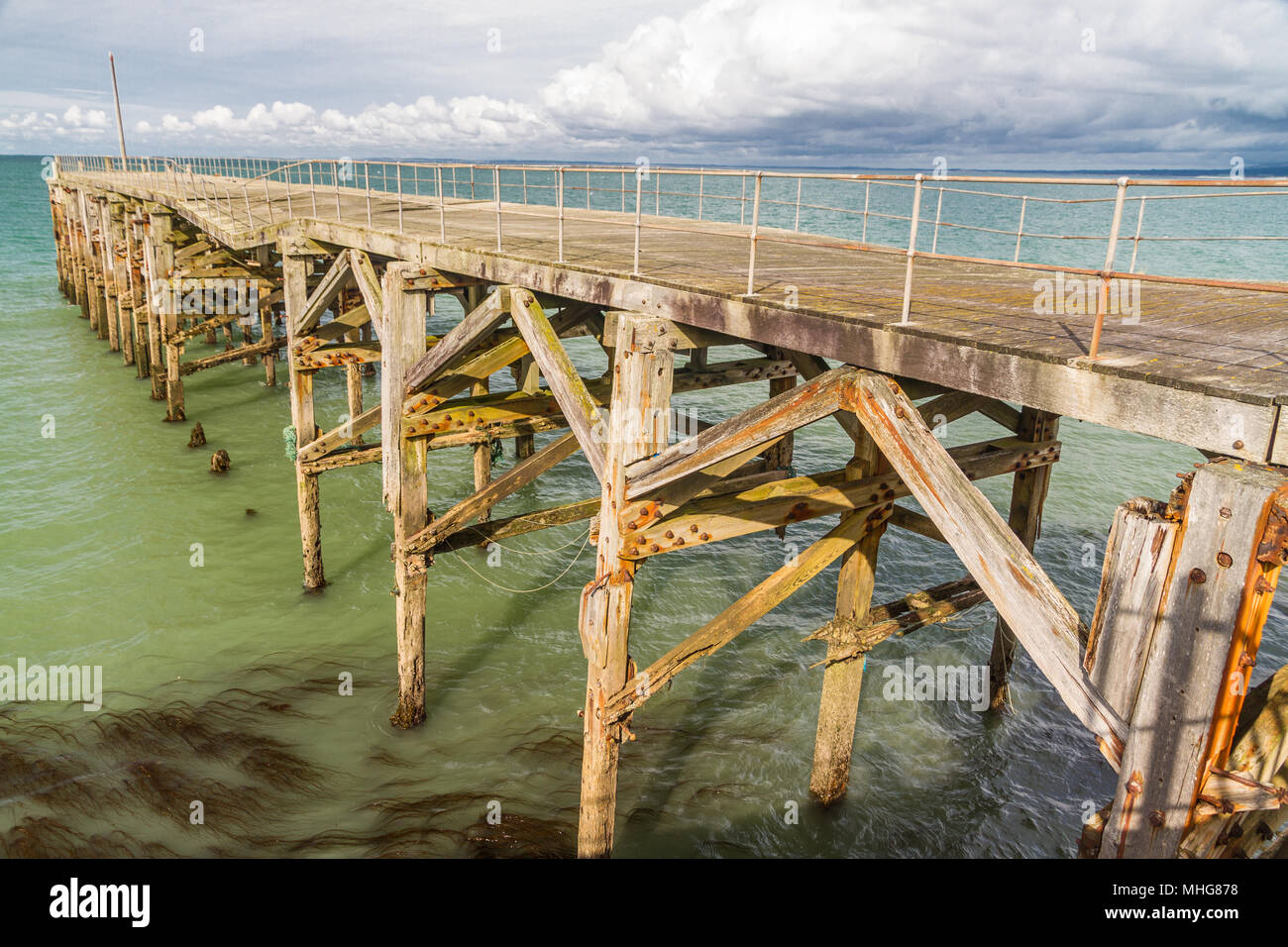 The derelict wooden pier at Trefor, llyn Peninsula, North Wales, UK ...