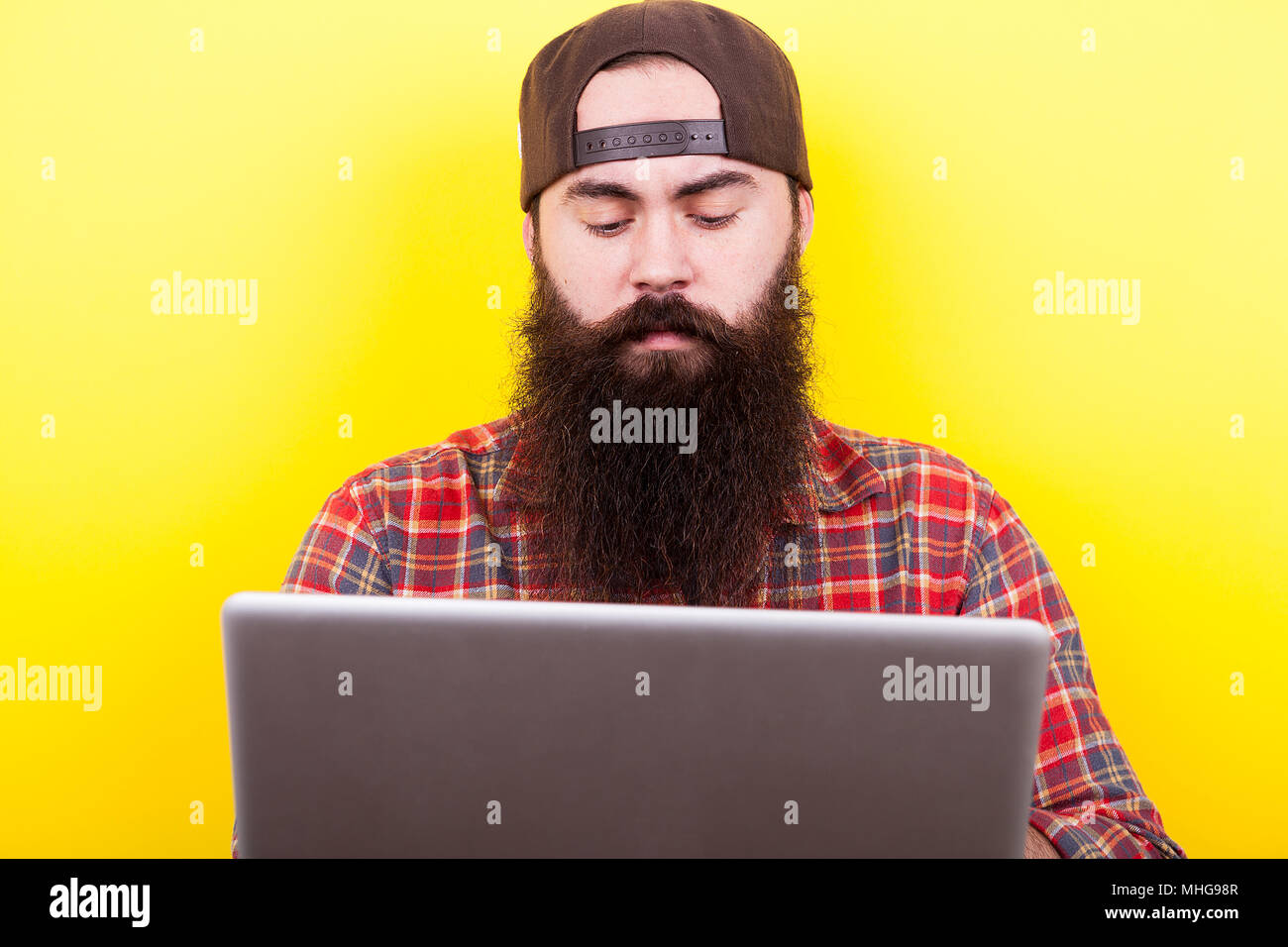 Happy bearded businessman smiling thinking hi-res stock photography and ...