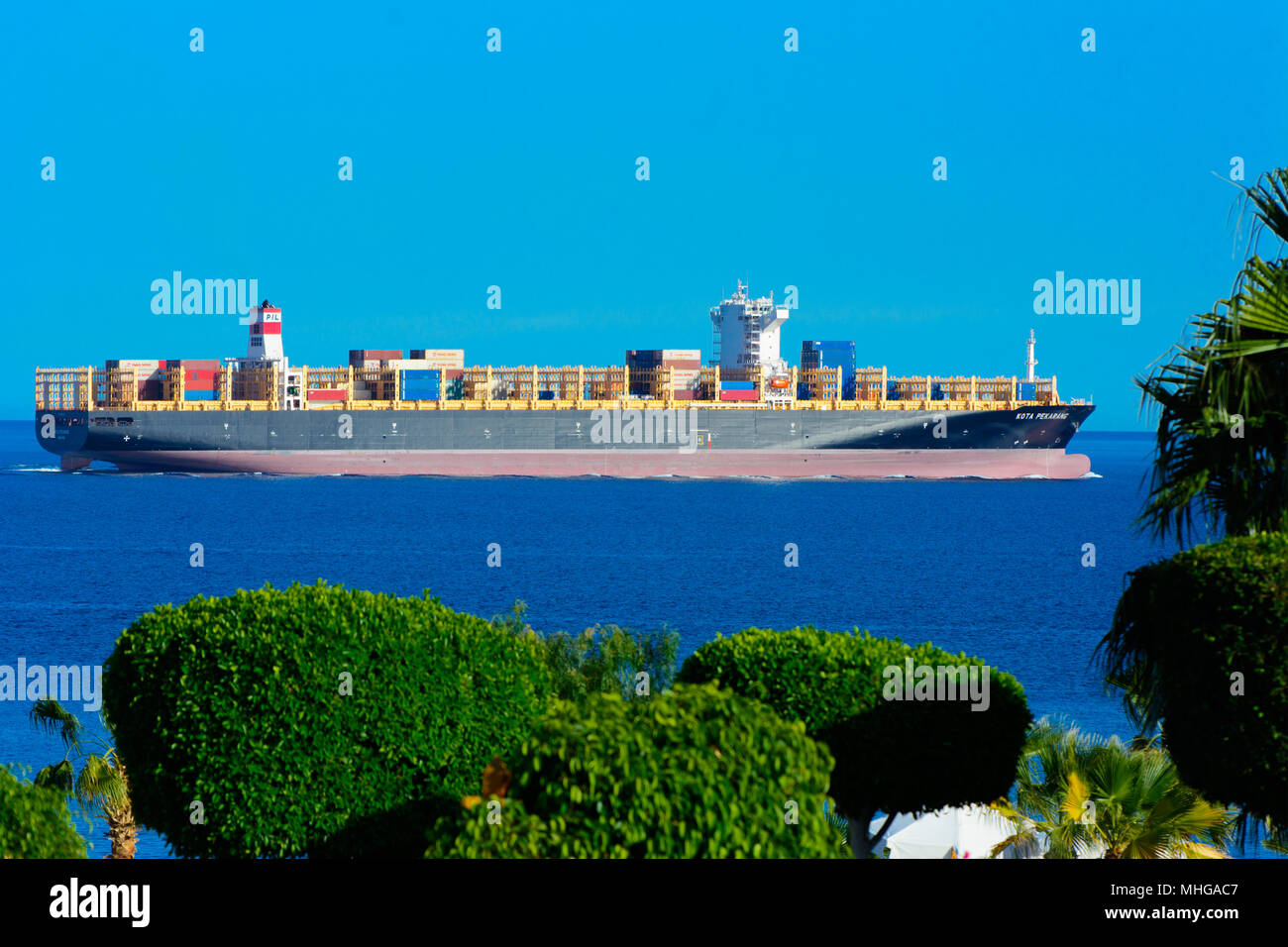 Sharm el-Sheikh, Egypt - March 14, 2018. A huge cargo ship carries ...