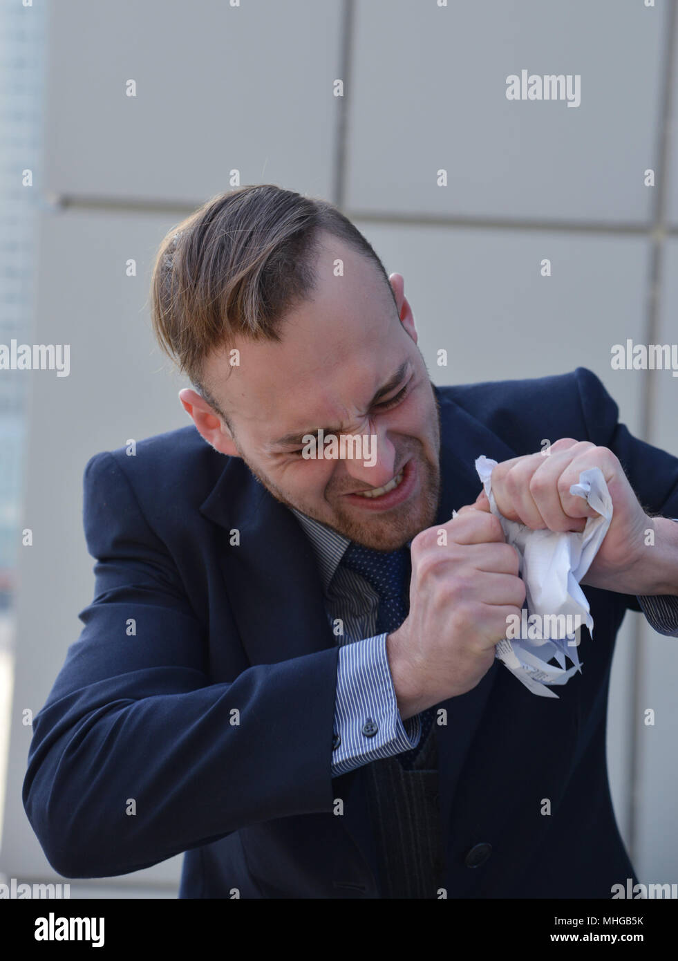 Man tear to pieces sheet of paper hi-res stock photography and images ...