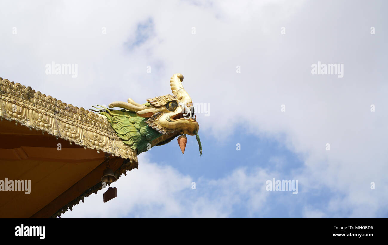 Brass statue on the roof with sky Stock Photo - Alamy