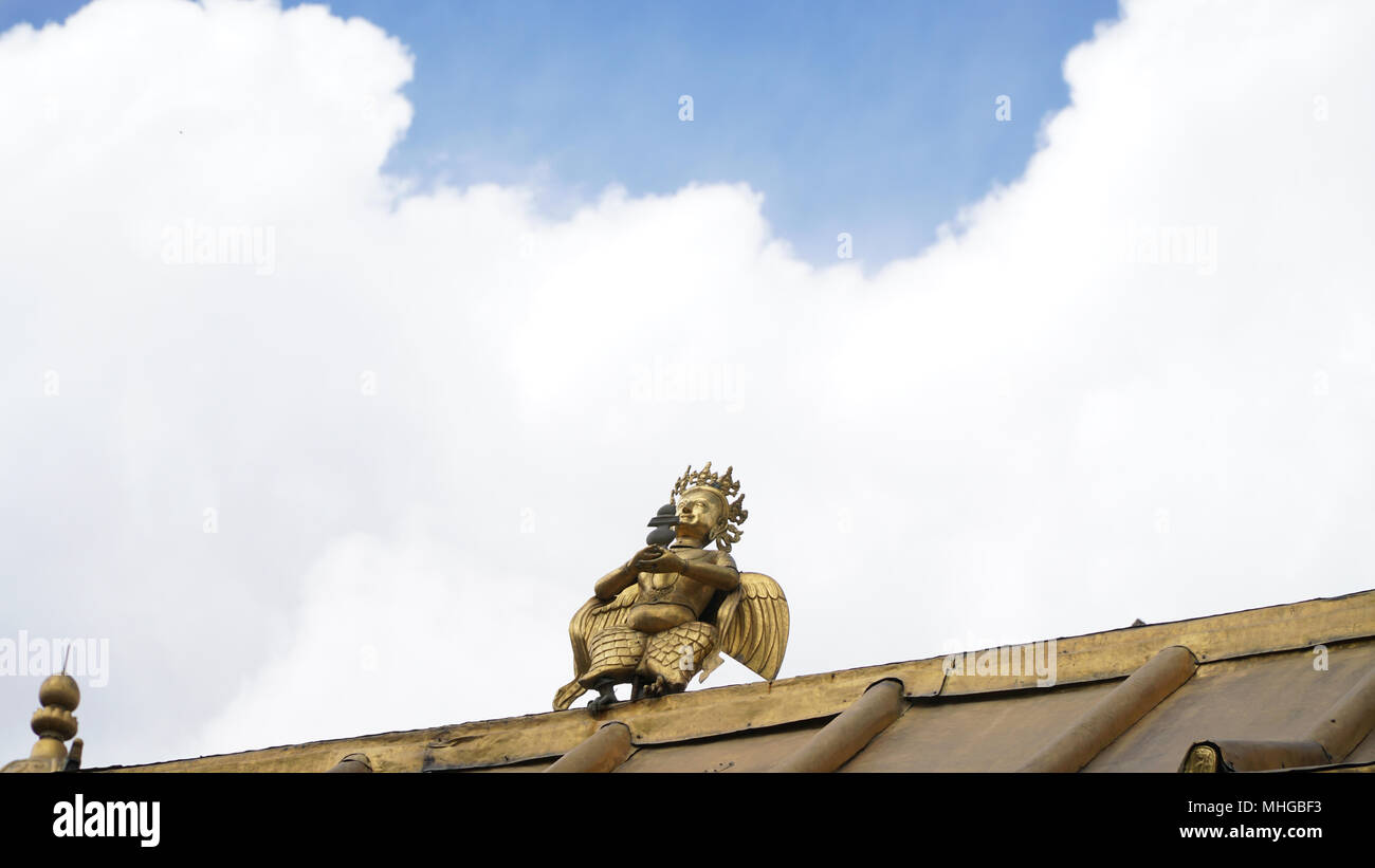 Brass statue on the roof with sky Stock Photo - Alamy