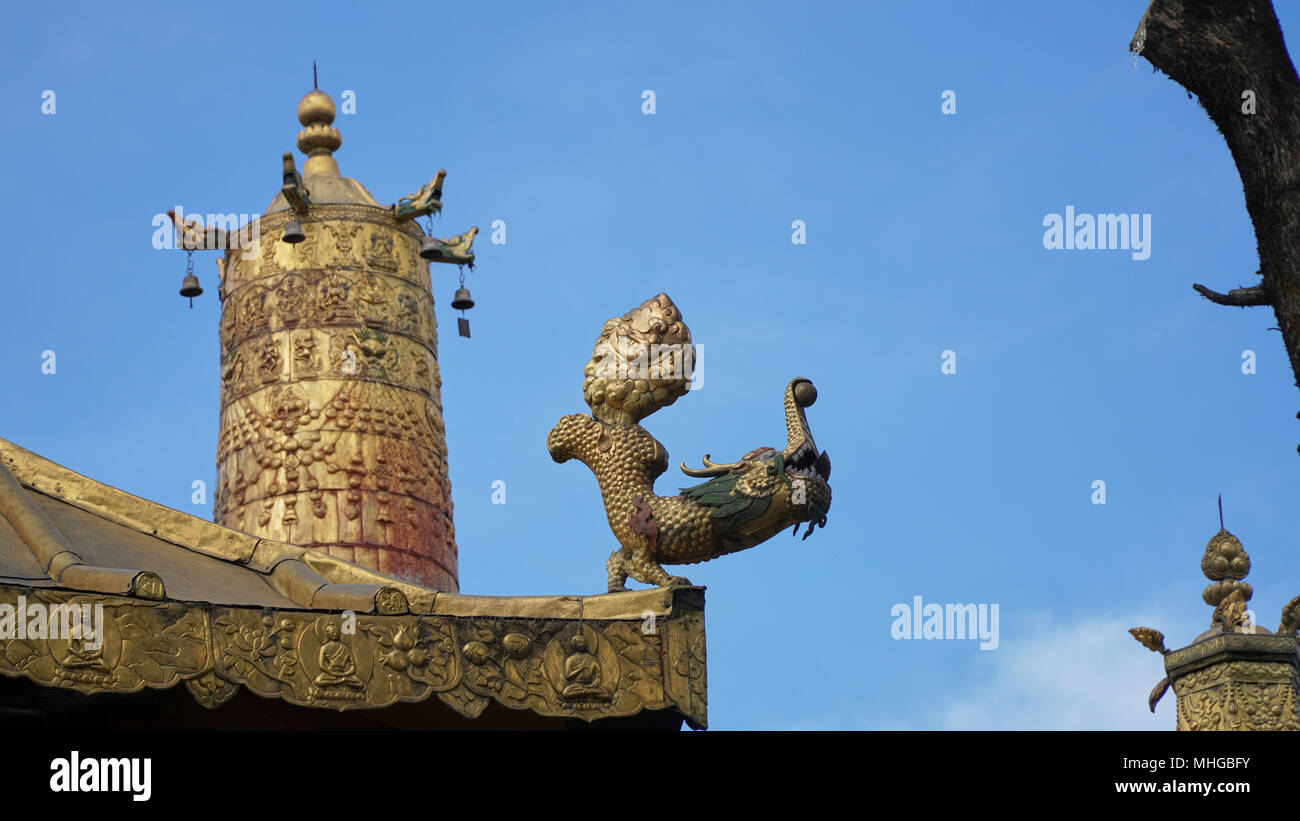 Brass statue on the roof with sky Stock Photo - Alamy