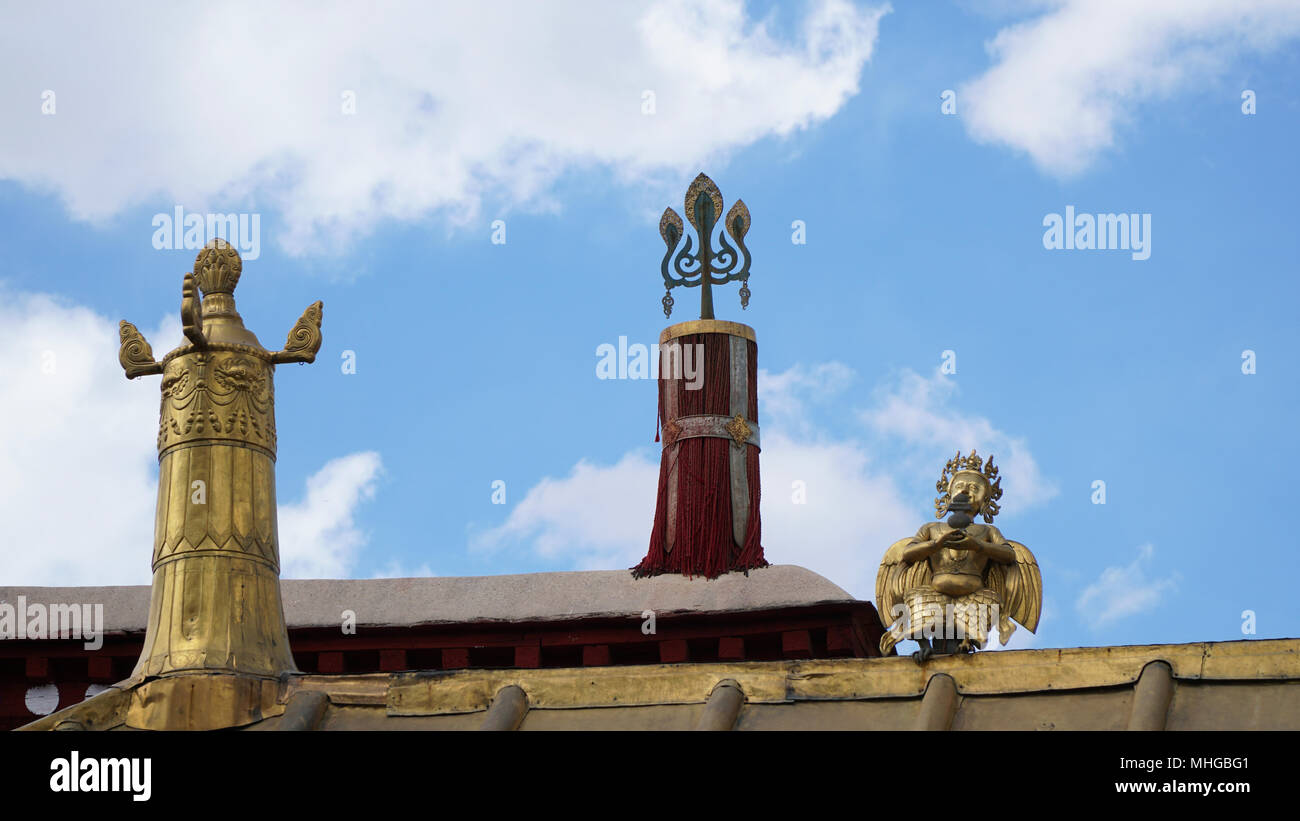 Brass statue on the roof with sky Stock Photo - Alamy