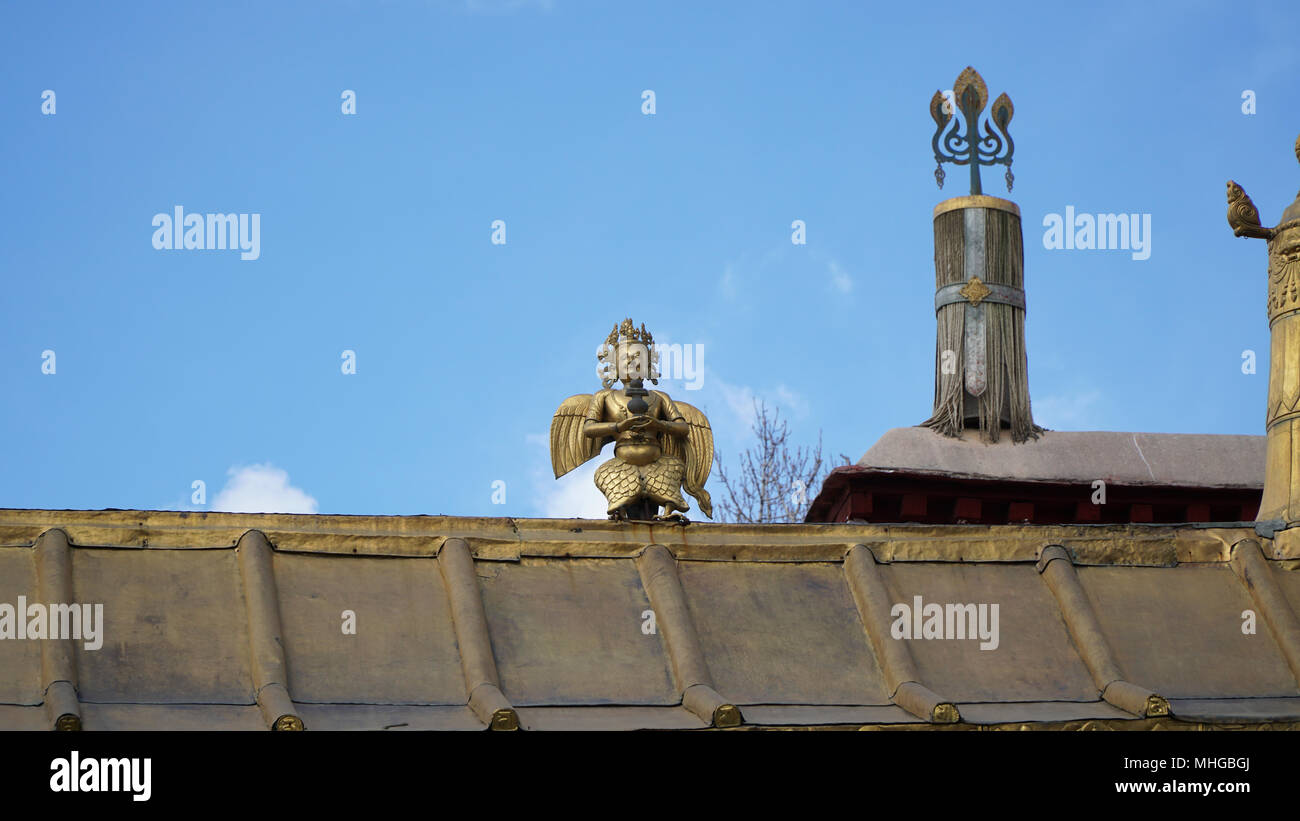 Brass statue on the roof with sky Stock Photo - Alamy
