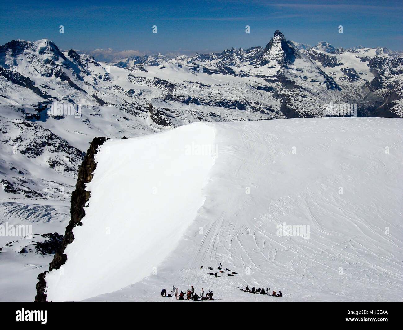 many back country skiers on a high summit plateau in the Swiss Alps ...