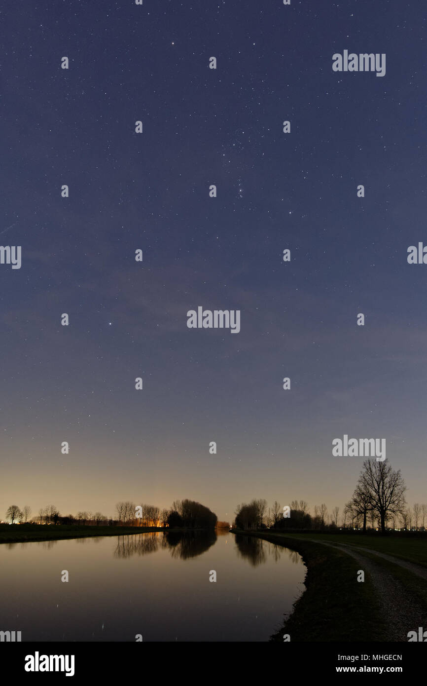 Starry night in Italy by the river Stock Photo - Alamy