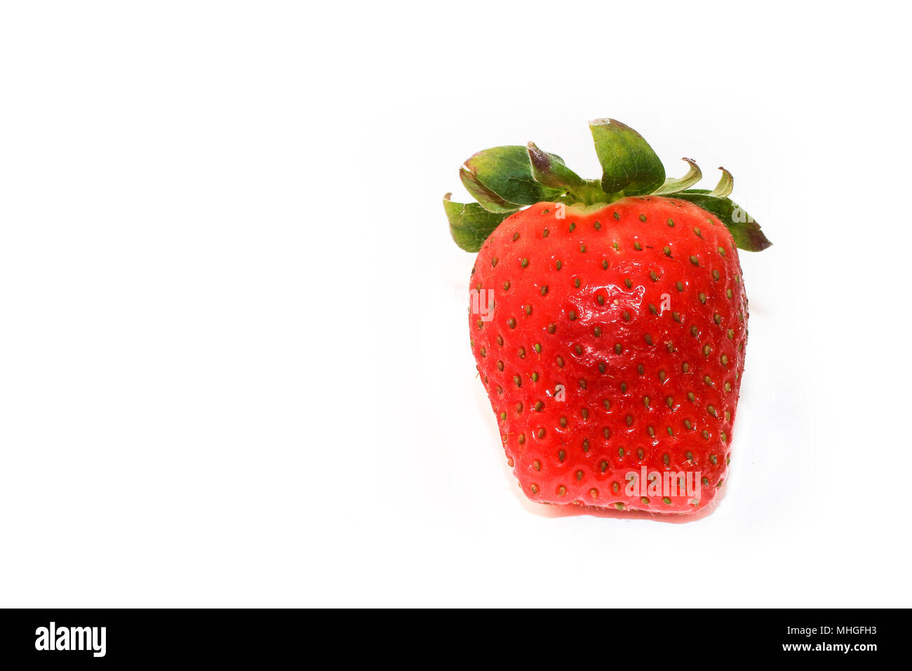 One single fresh and natural red strawberry of rectangular shape, with ...
