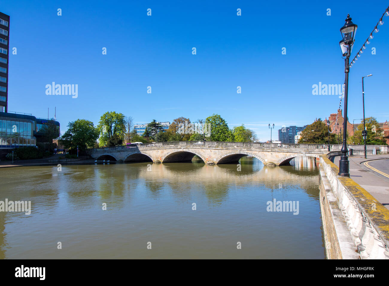 The River Great Ouse flows peacefully through Town Bridge in Bedford ...