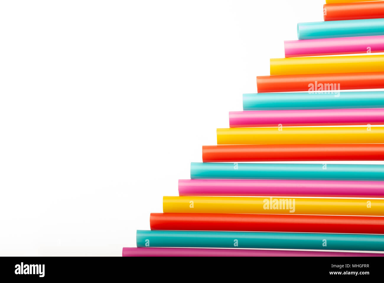 Straws in all colors with lots of copy space. All in a diagonal ...