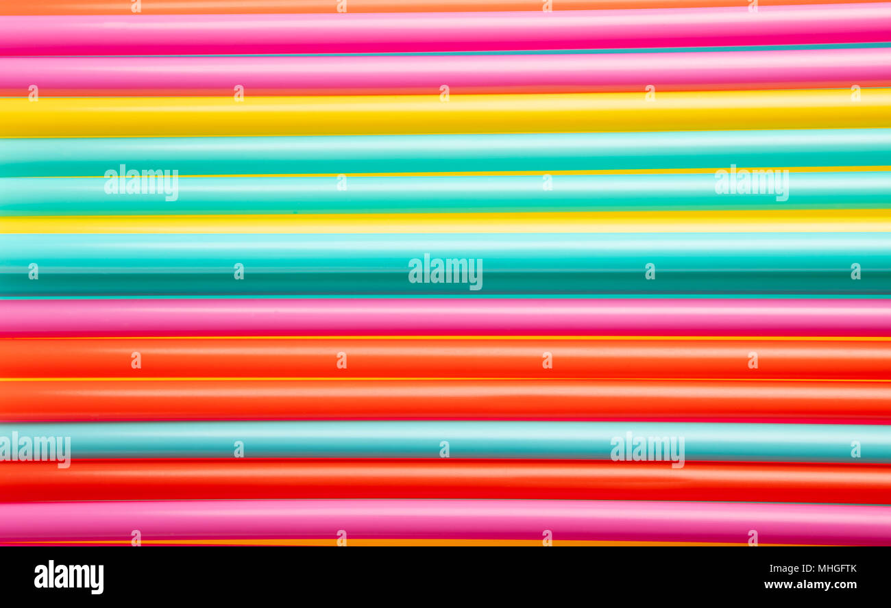 Pile of colorful plastic drinking straws background top view of high ...