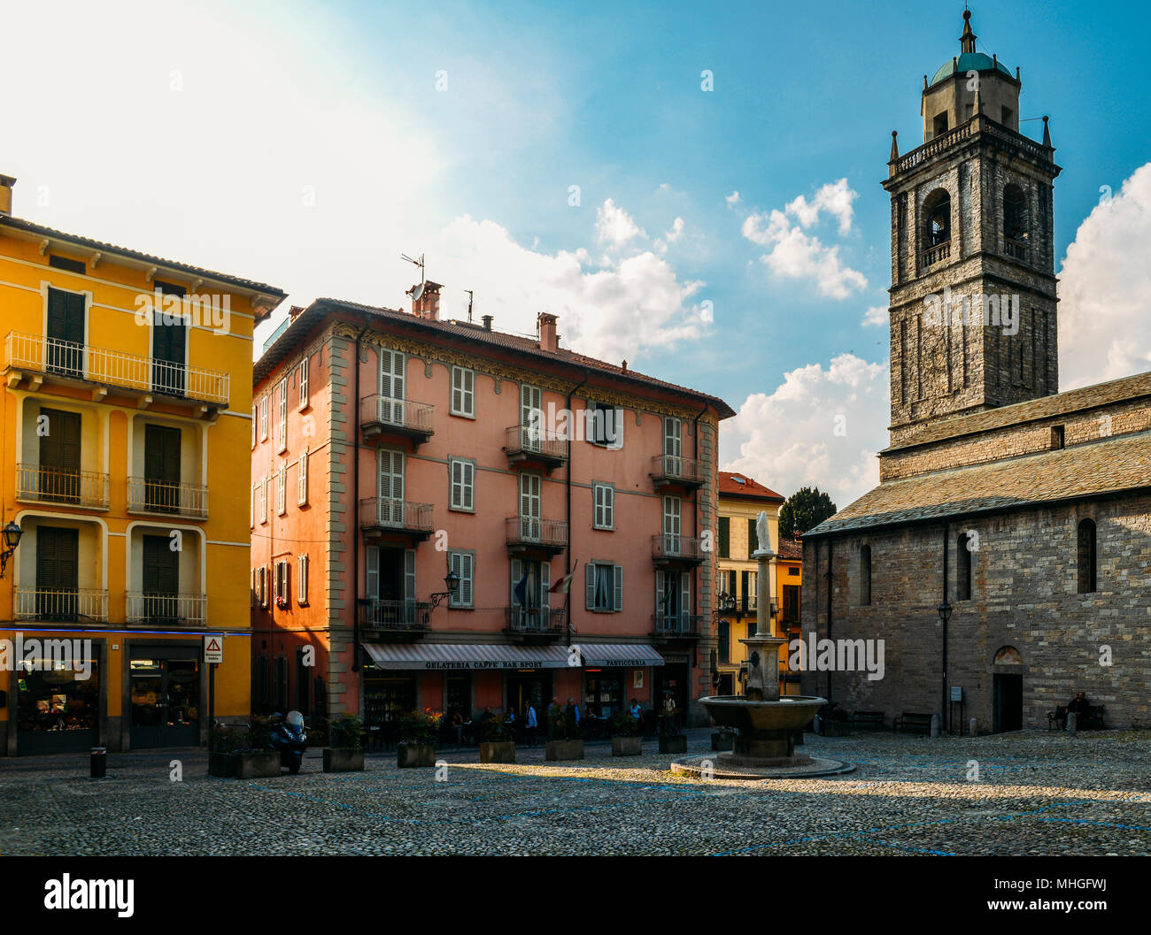 Traditional Italian piazza with a public water fountain outside the ...