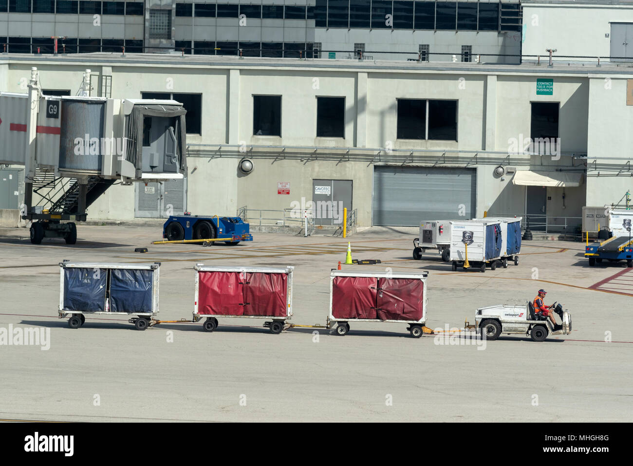 Baggage tractor hi-res stock photography and images - Alamy