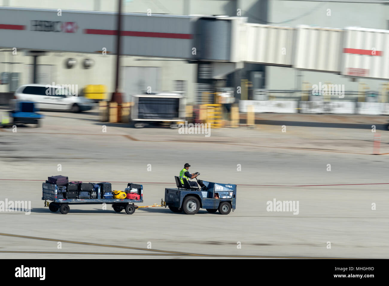 Baggage tractor hi-res stock photography and images - Alamy