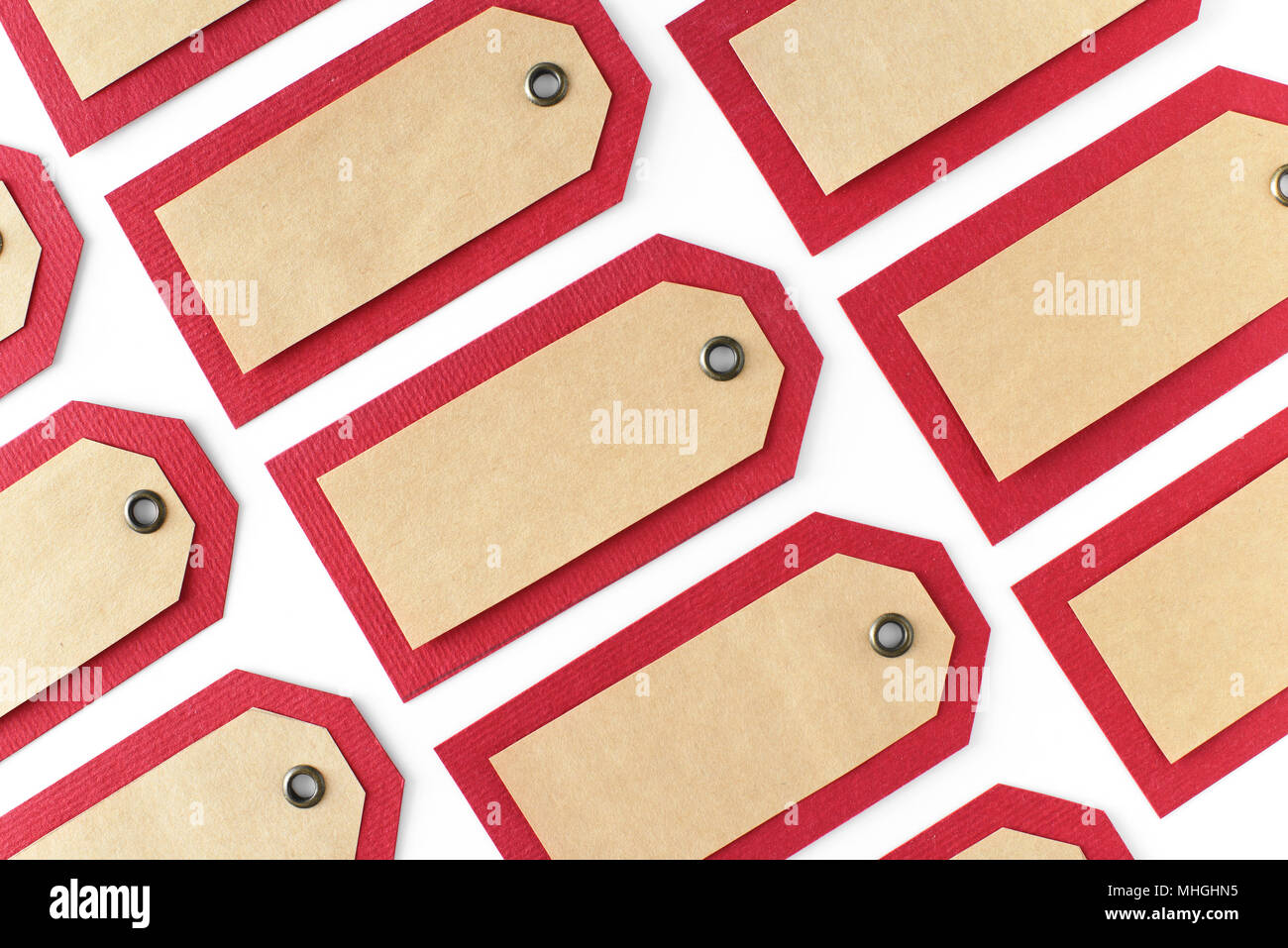 Recycled craft paper red tags in a row isolated on white background ...