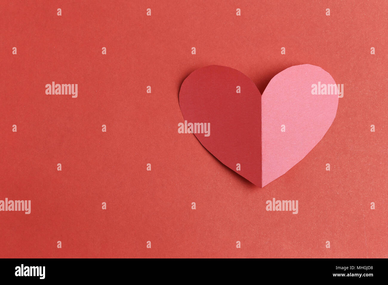 Heart shape of paper on the red cardboard background in Concept for ...