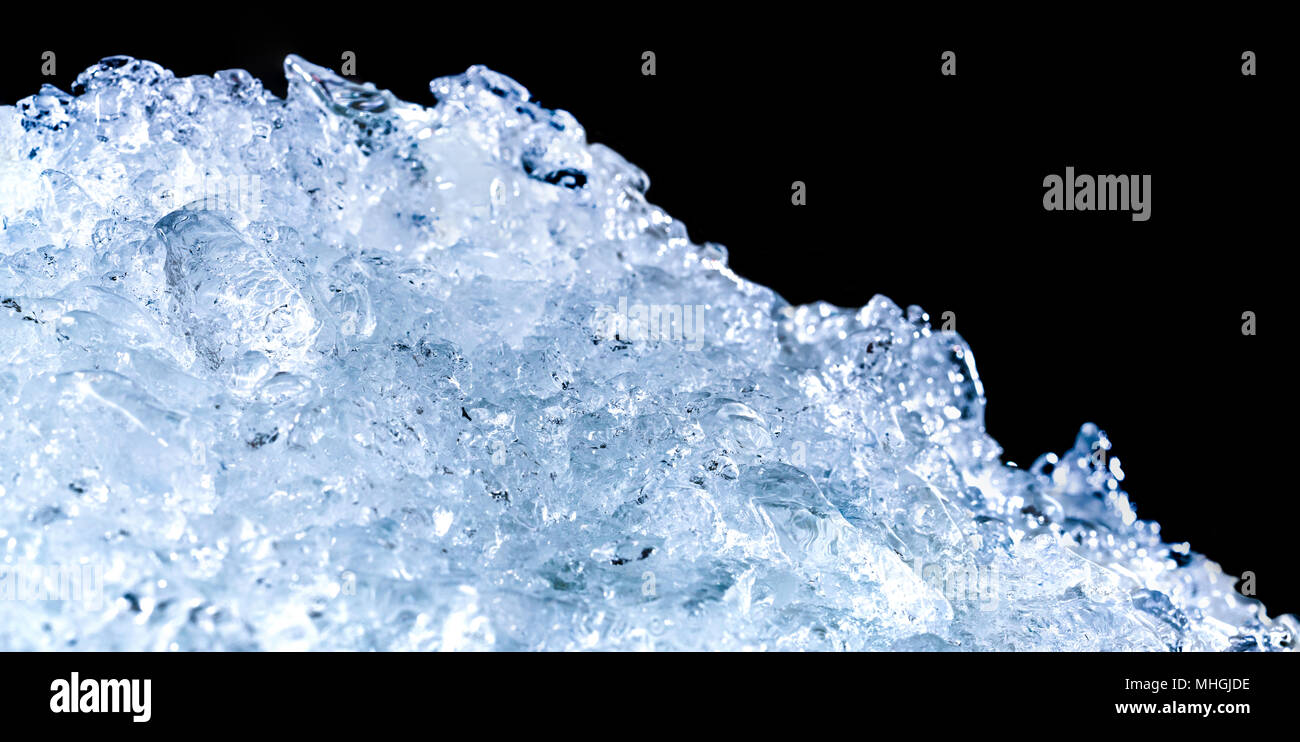 Pile of crushed ice cubes on dark background with copy space. Crushed ...