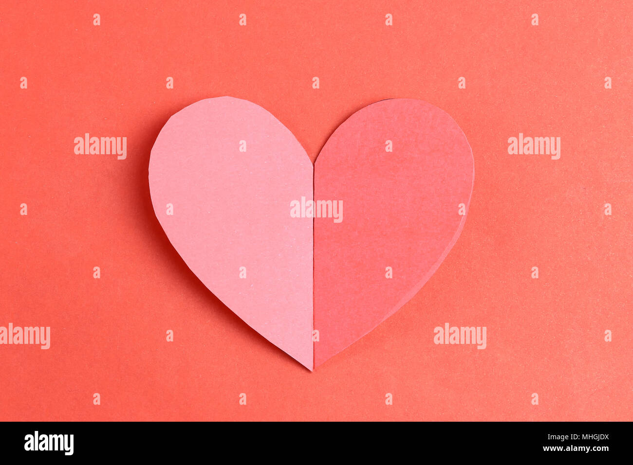 Heart shape of paper on the red cardboard background in Concept for ...