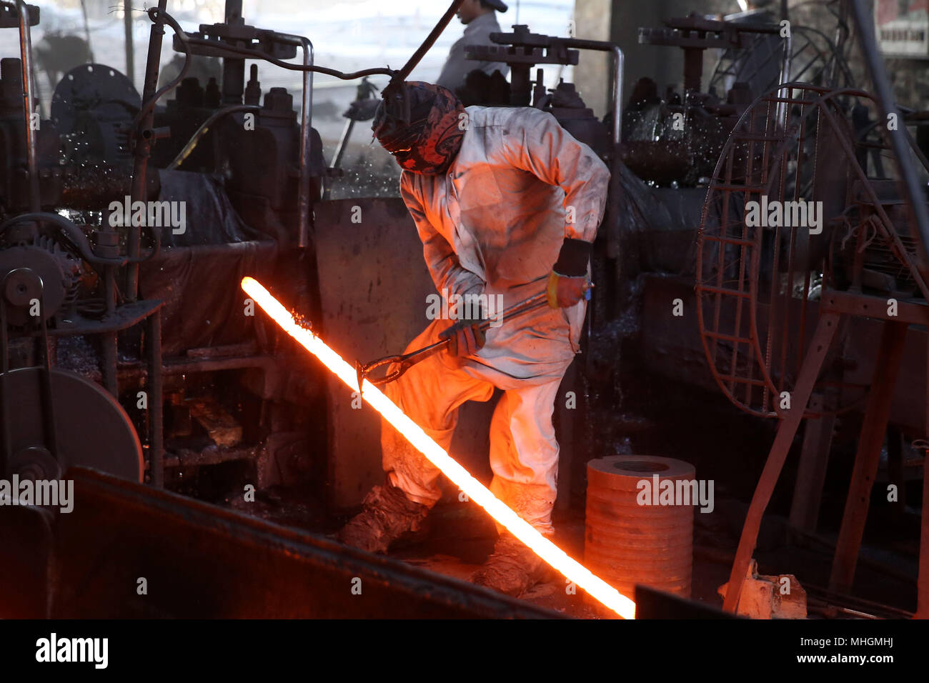 Islamabad. 1st May, 2018. A laborer works at an iron factory on Labor ...