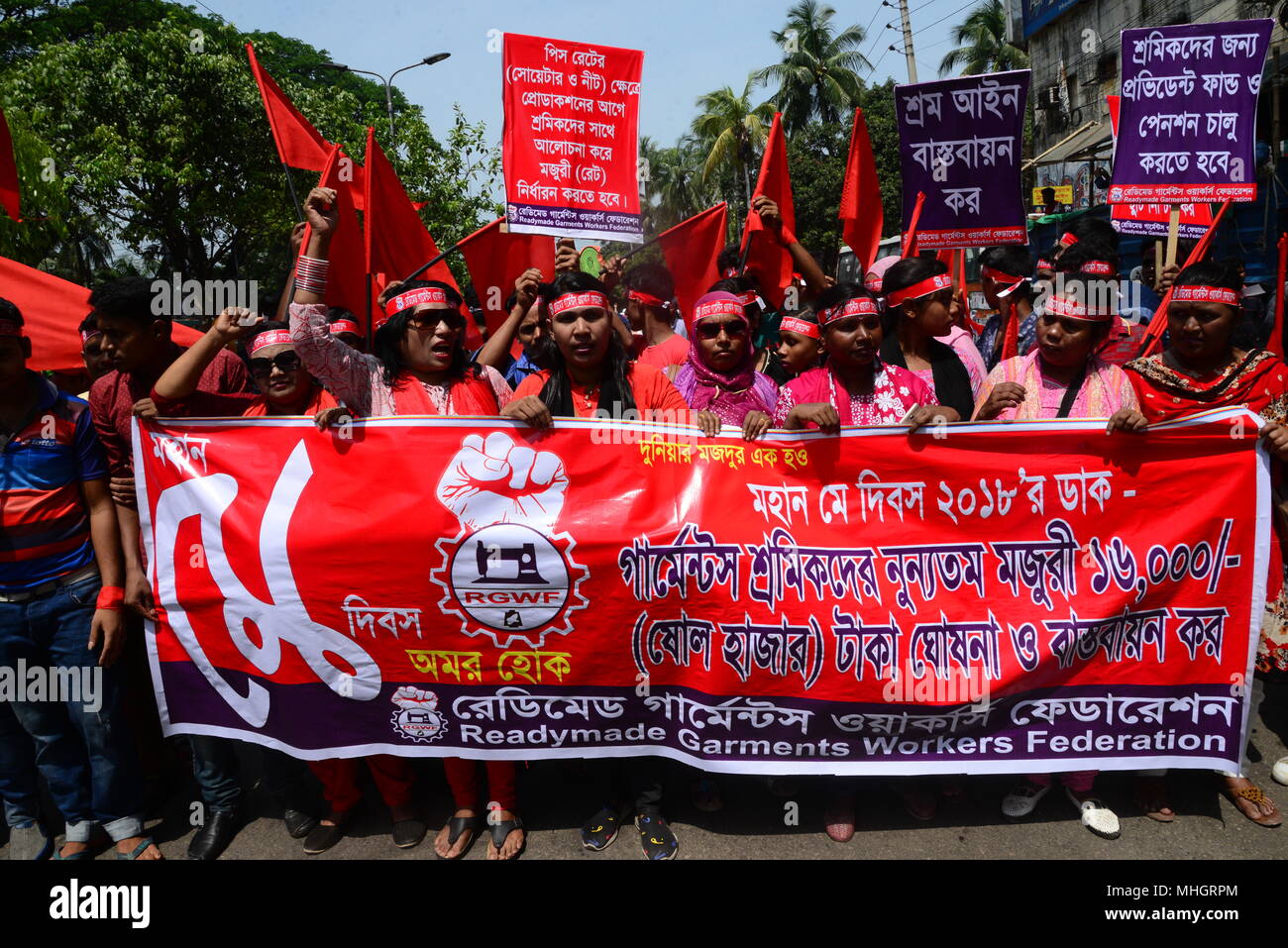Bangladeshi garment workers and other labor organization members take ...