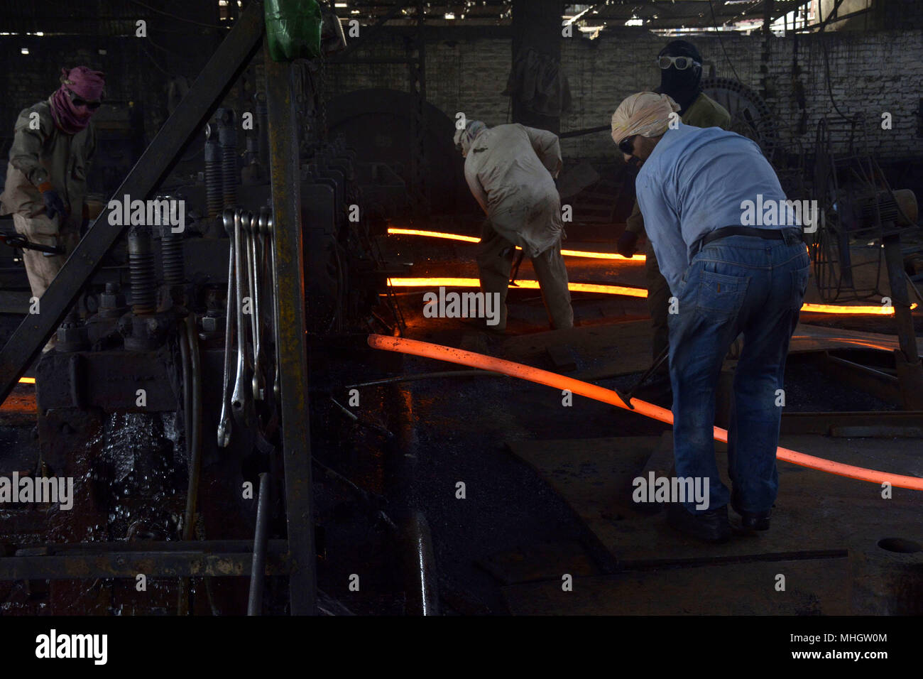 Lahore. 1st May, 2018. Laborers work at an iron factory on the ...